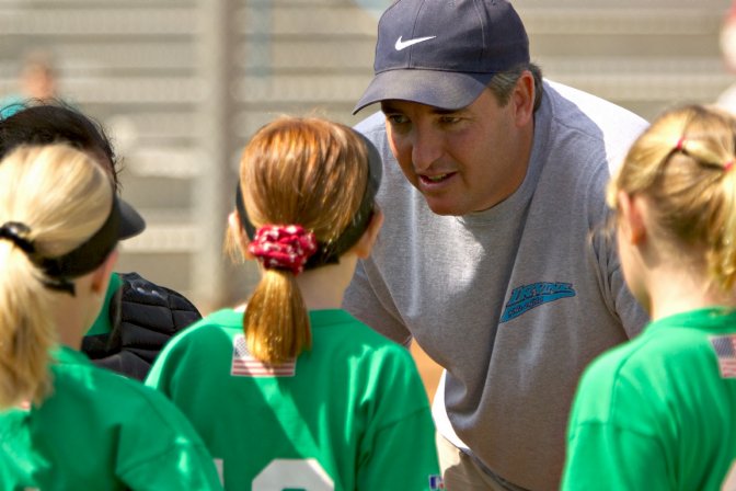 Coach Todd huddles with the players