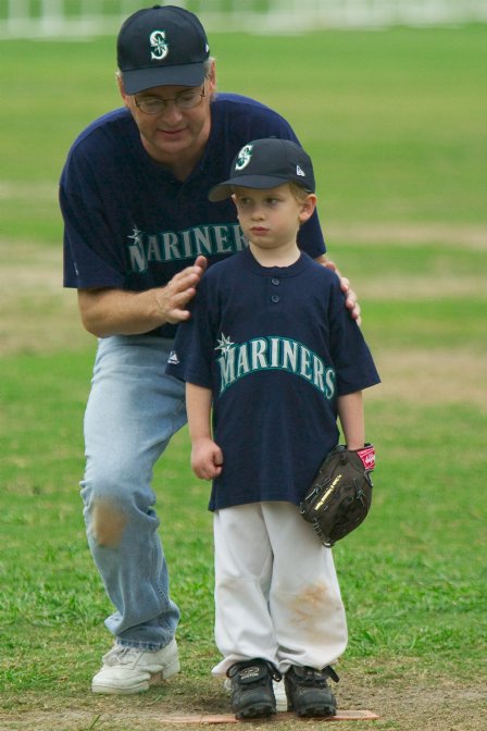 Jacob gets some coaching at the pitcher's mound